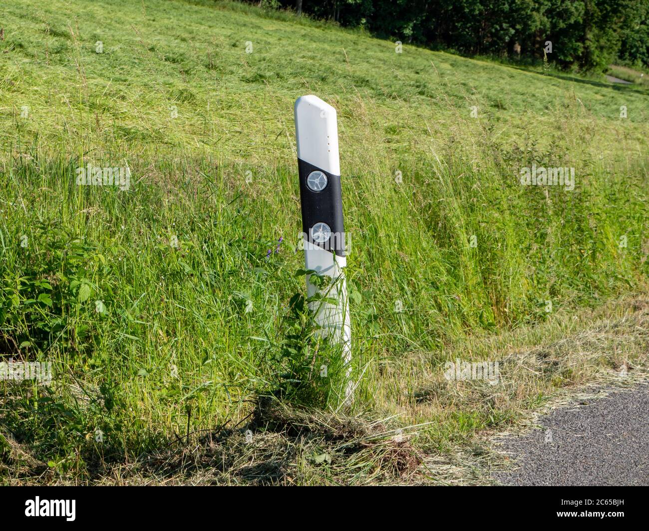 Roadside post on a country road in germany Stock Photo - Alamy