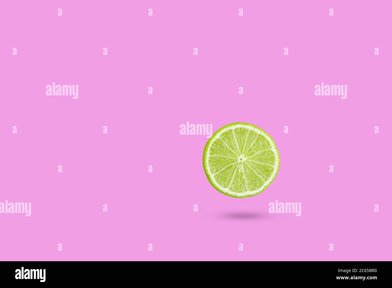 Falling lime isolated on white background. Green lime slic on vibrant ...