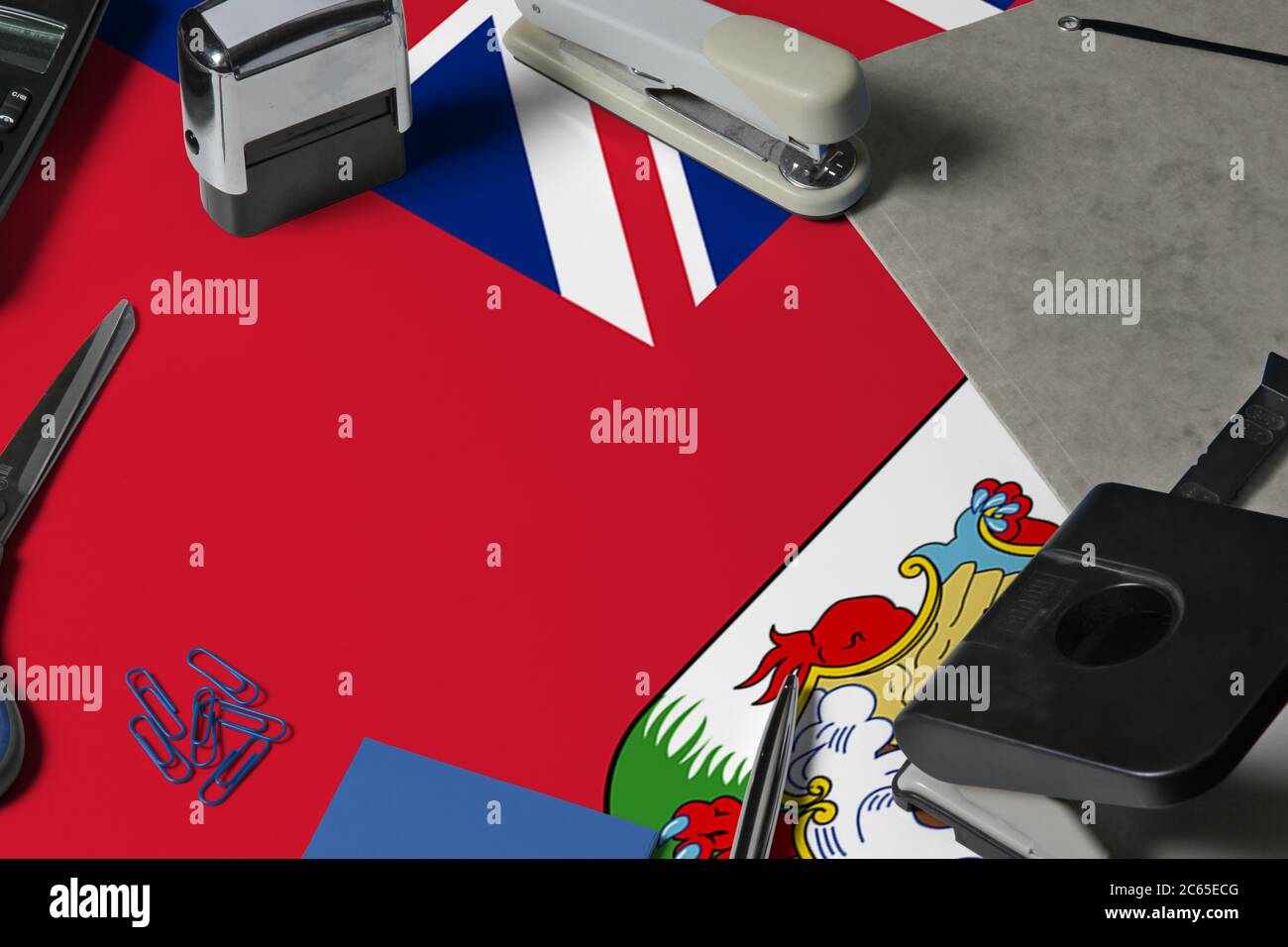 Bermuda flag with office clerk workplace background. National ...