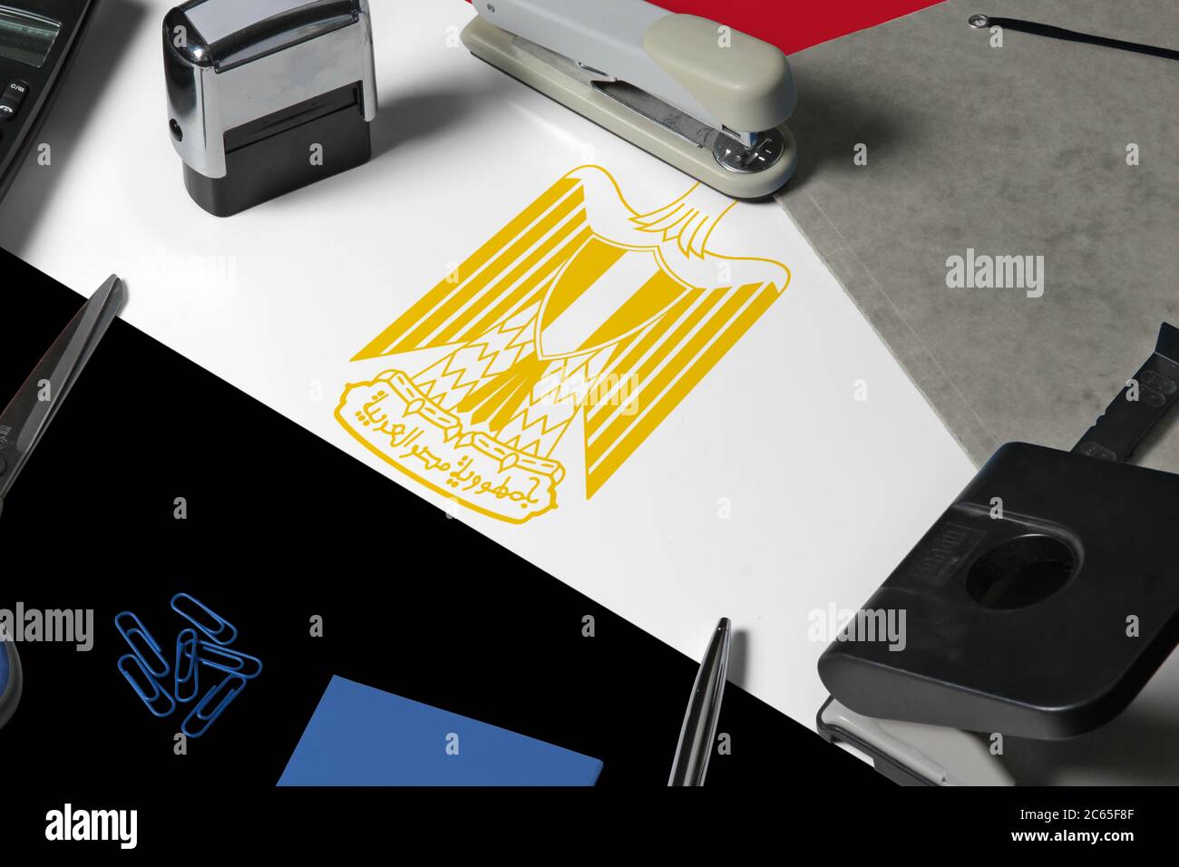 Egypt flag with office clerk workplace background. National stationary ...
