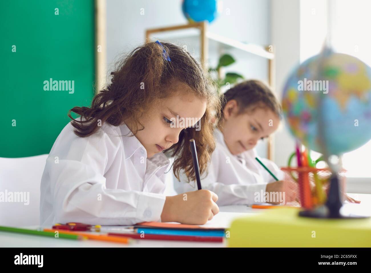 Preschool classroom children table hi-res stock photography and images ...