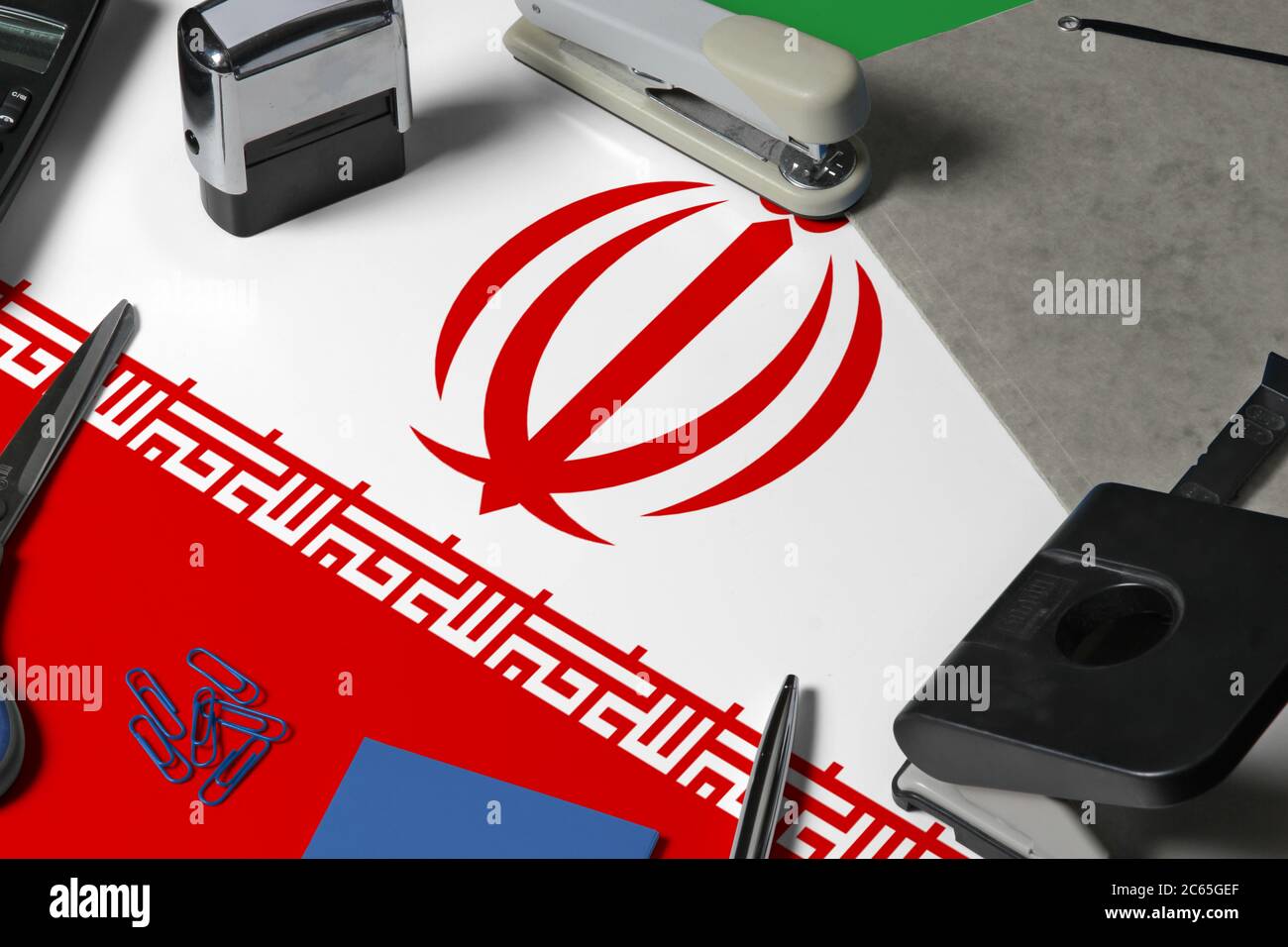 Iran flag with office clerk workplace background. National stationary ...