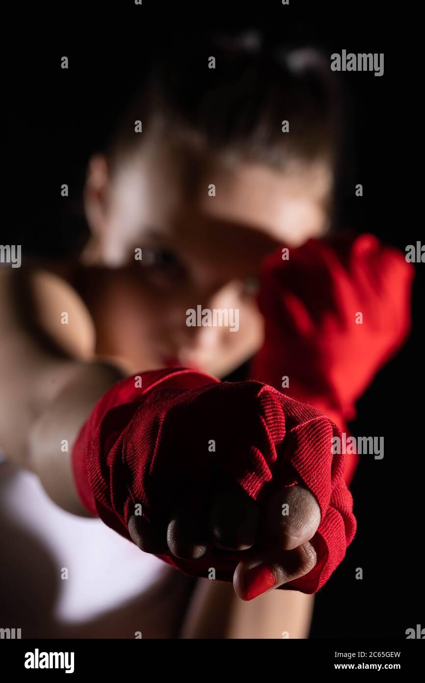 A strong punch with the fist straight ahead to the target. The athlete ...