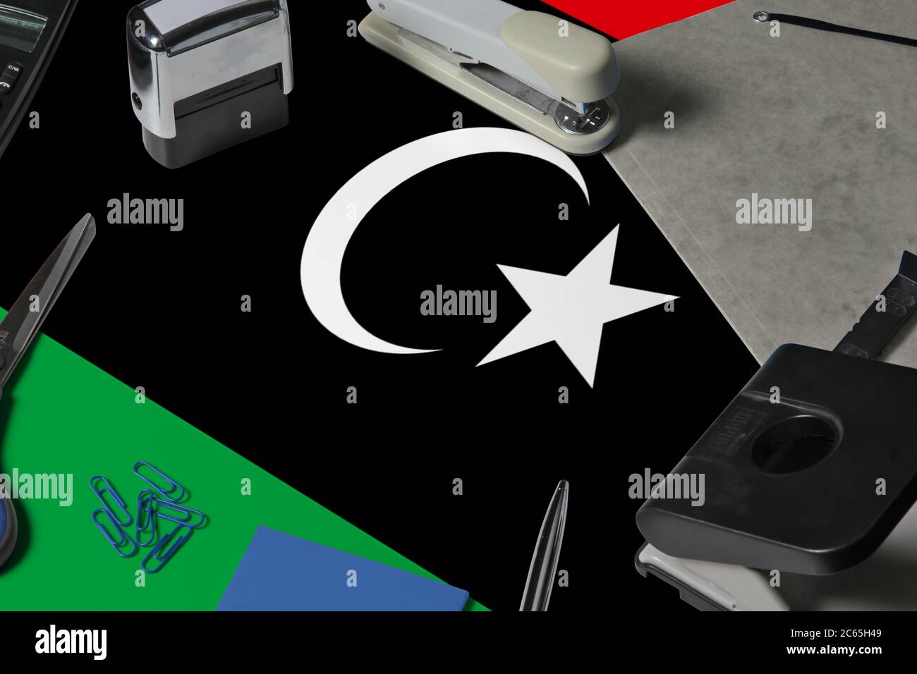 Libya flag with office clerk workplace background. National stationary ...
