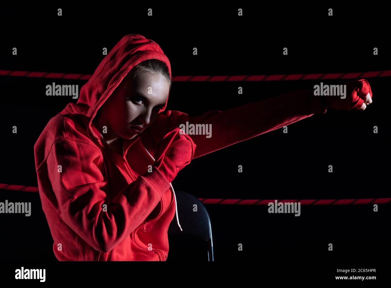 A strong punch with the fist straight ahead to the target. The athlete ...