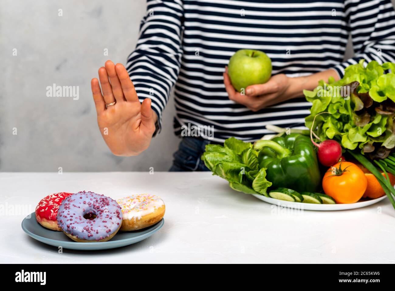 woman refuse junk food but healthy food choice. Diet concept Stock ...
