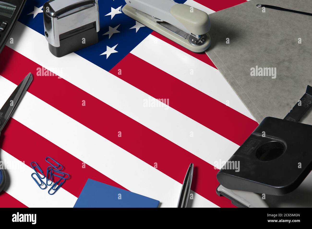 United States flag with office clerk workplace background. National ...