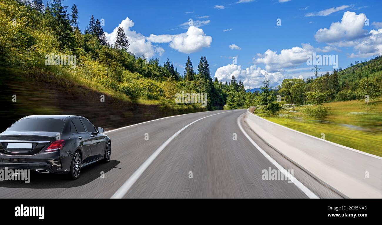 Luxury black car on highway hi-res stock photography and images - Alamy
