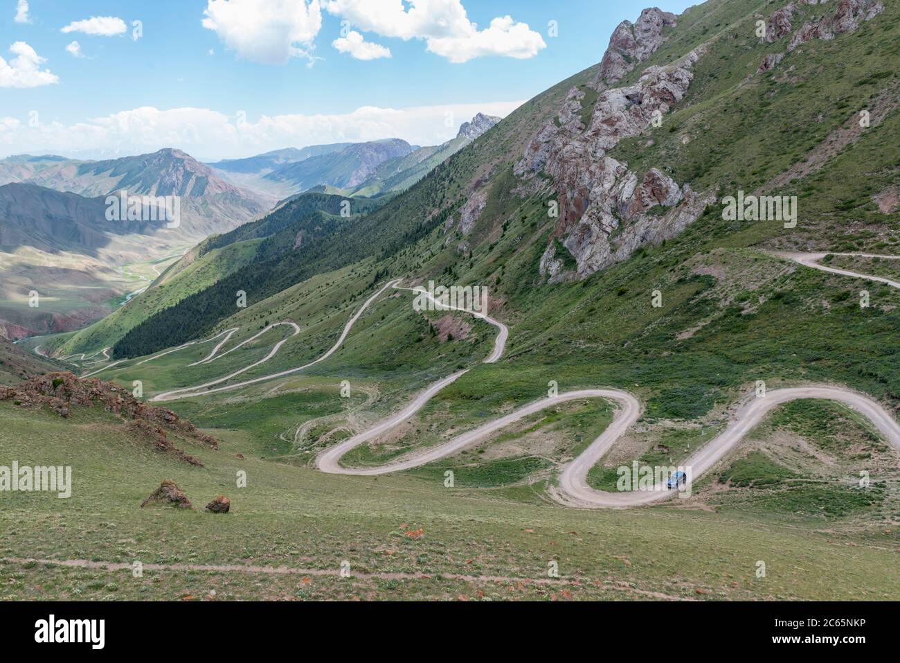 Winding road leading up to the plateau of Son Kol lake. Kyrgyzstan ...