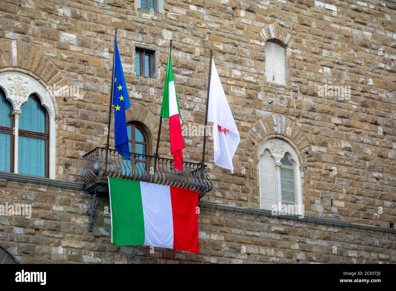 tree flags on a balcony, the italian flag, the firenze blazon ans ...