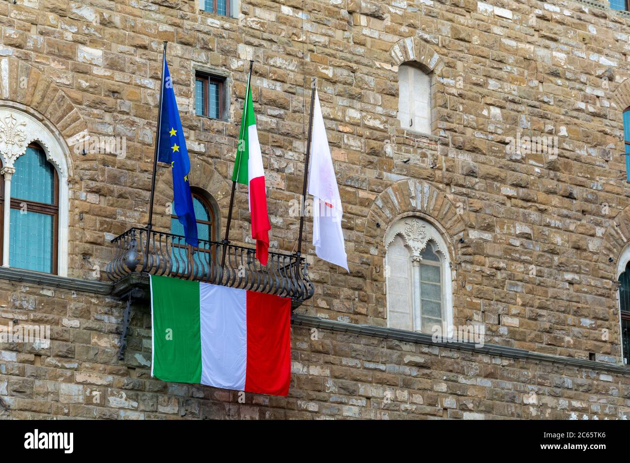 tree flags on a balcony, the italian flag, the firenze blazon ans ...