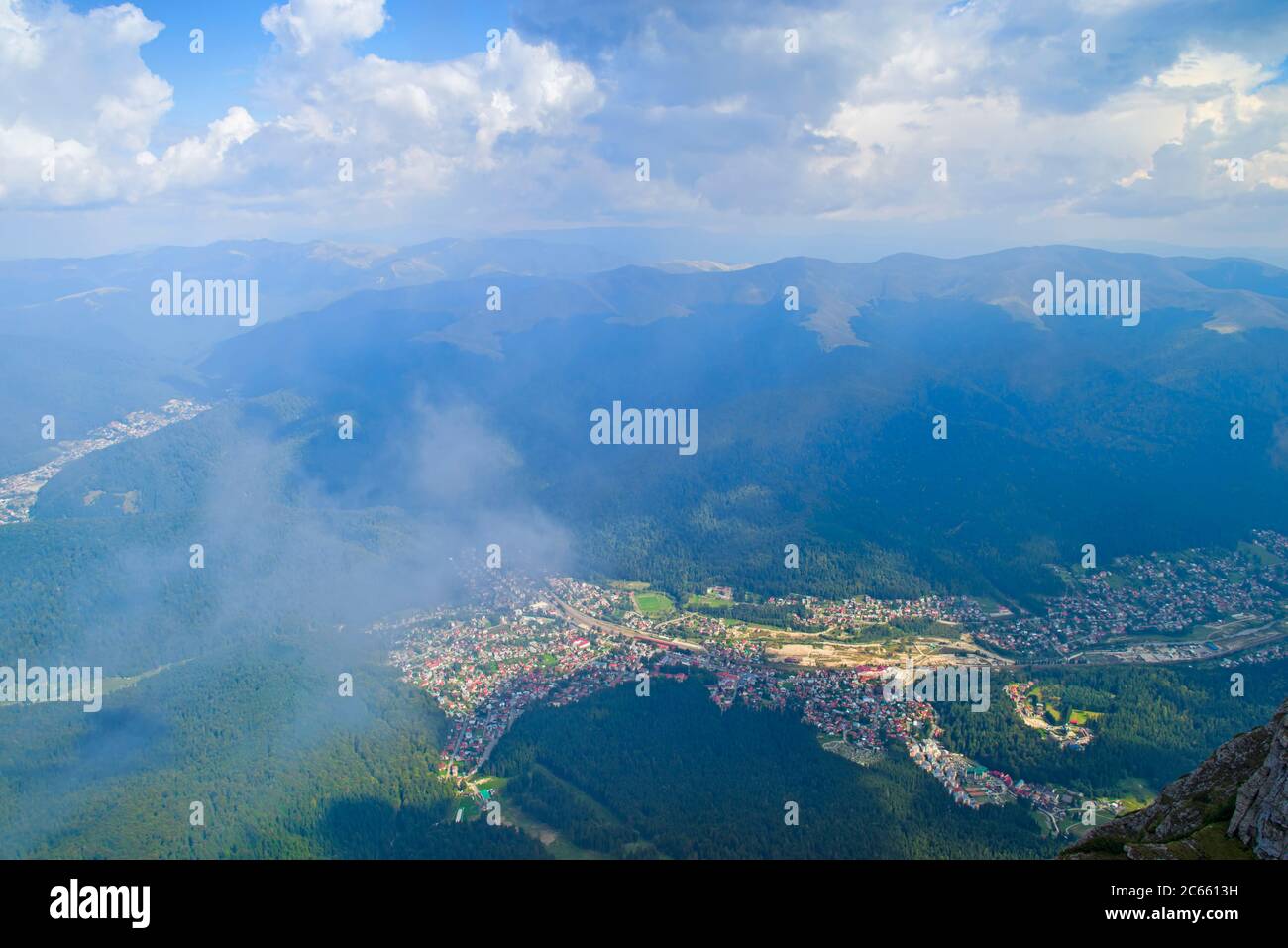 Aerial view of mountain city, Busteni city viewed from Bucegi mountains ...