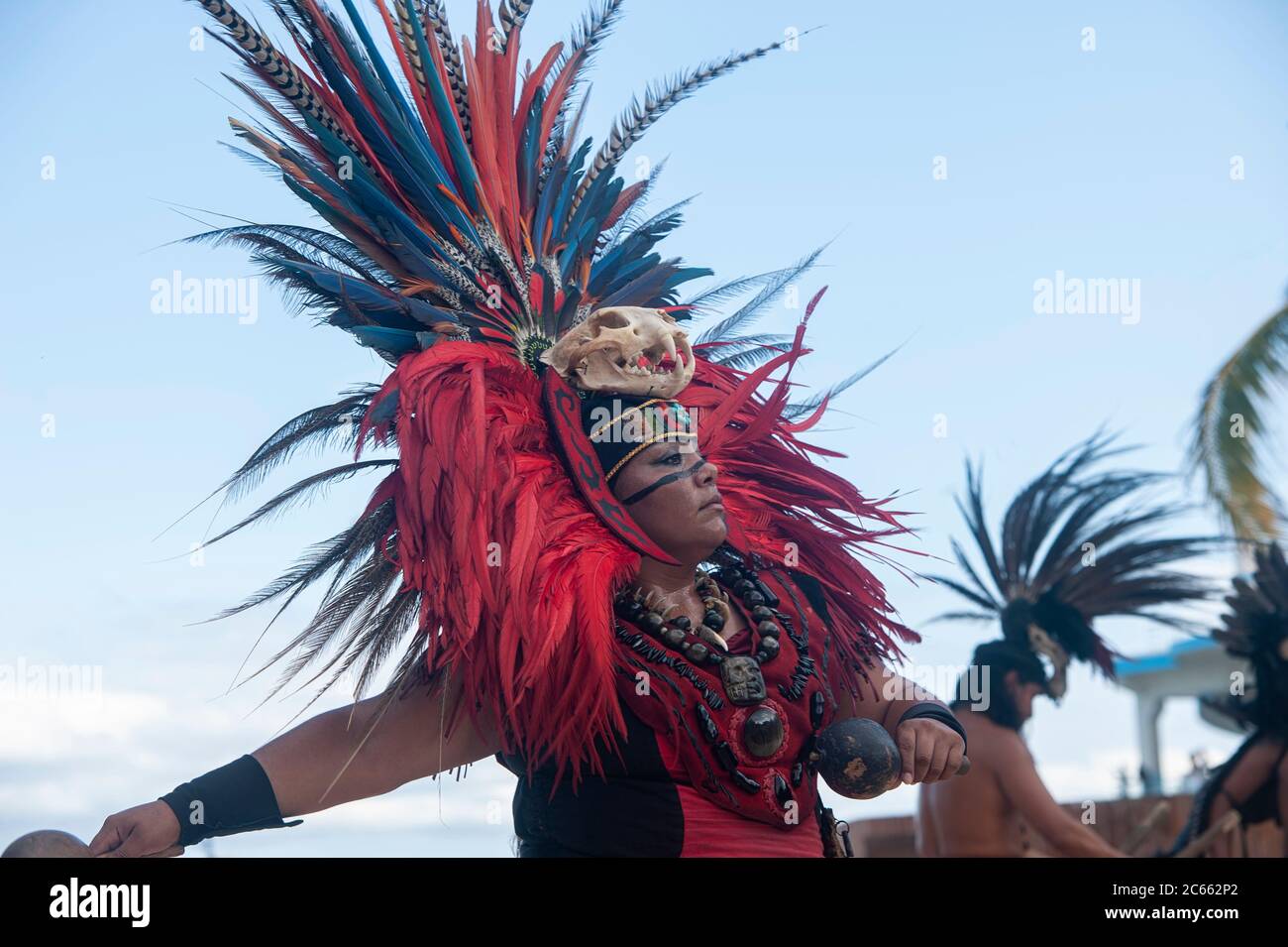 A unknown Mayan woman with traditional costume with feather headdress ...