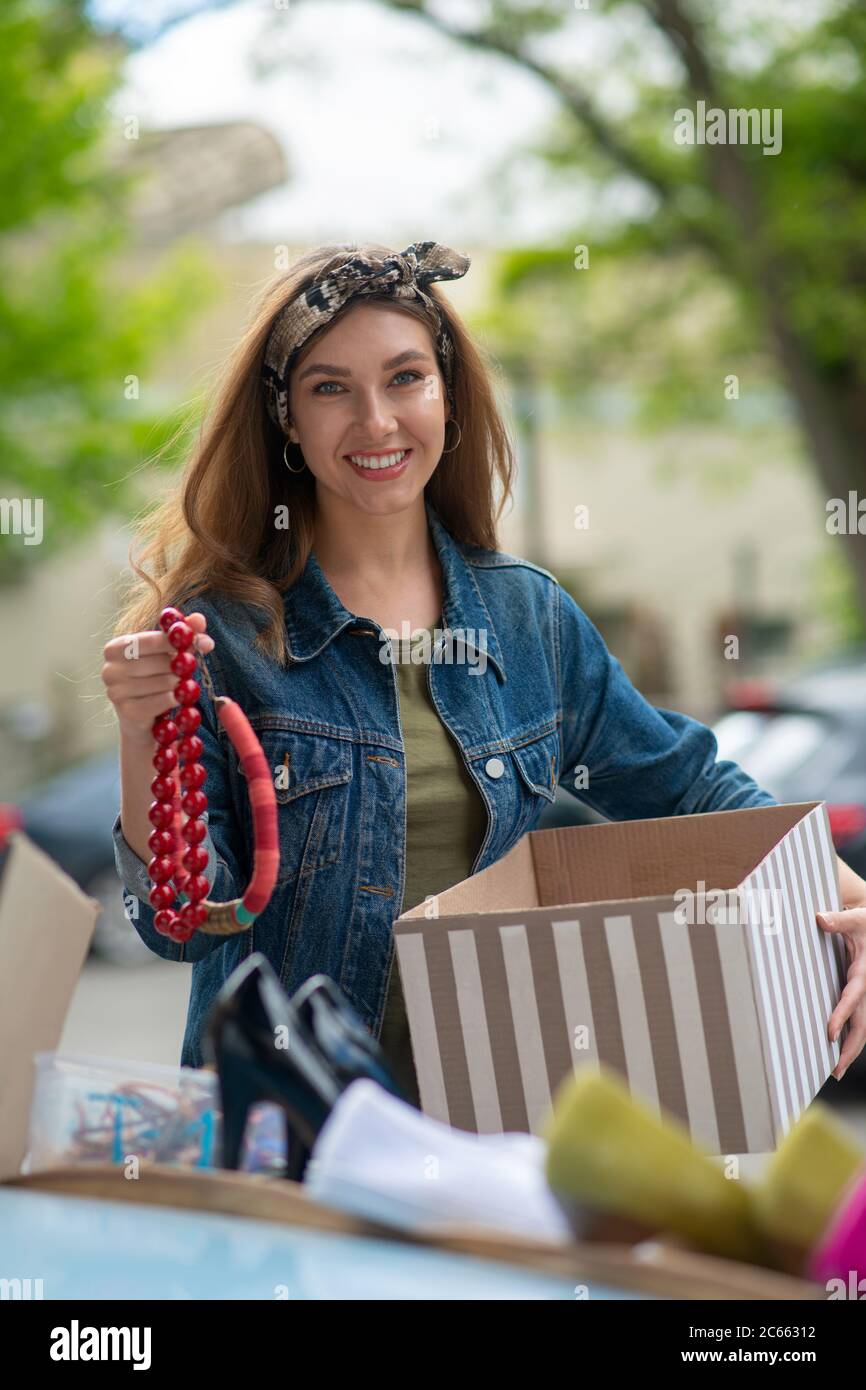 Woman garage sale box hi-res stock photography and images - Alamy