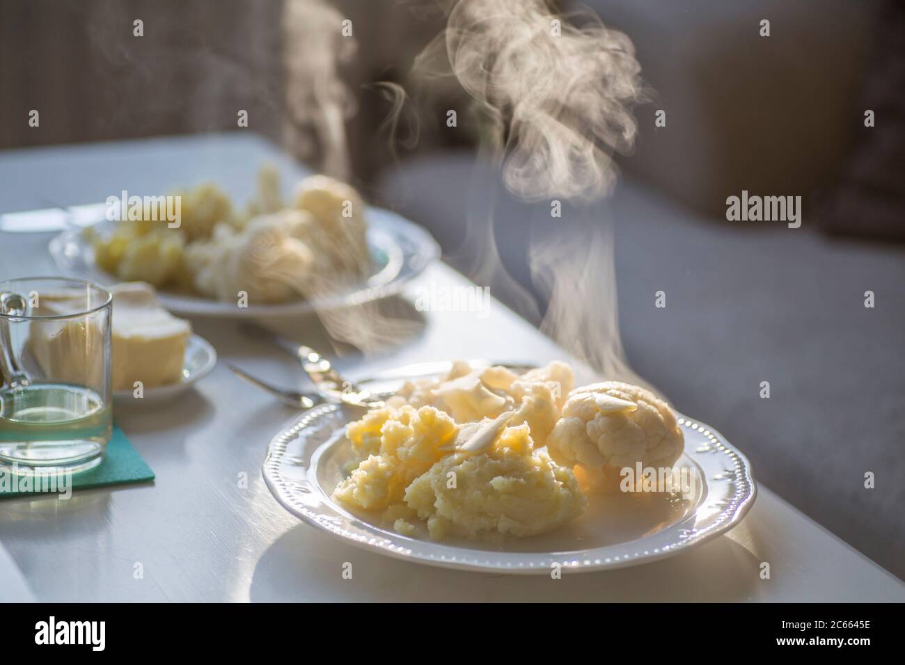 Food, plate, table, steaming cauliflower Stock Photo - Alamy