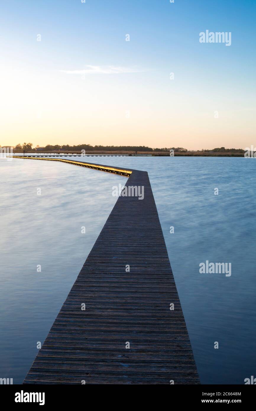 Wooden footbridge over a lake Stock Photo - Alamy