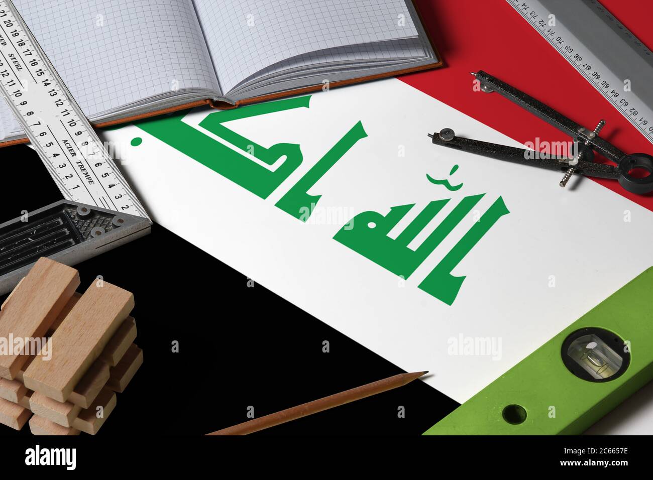 Iraq national flag on profession concept with architect desk and tools ...