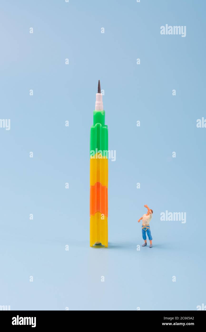 Pencil and man on blue background Stock Photo - Alamy