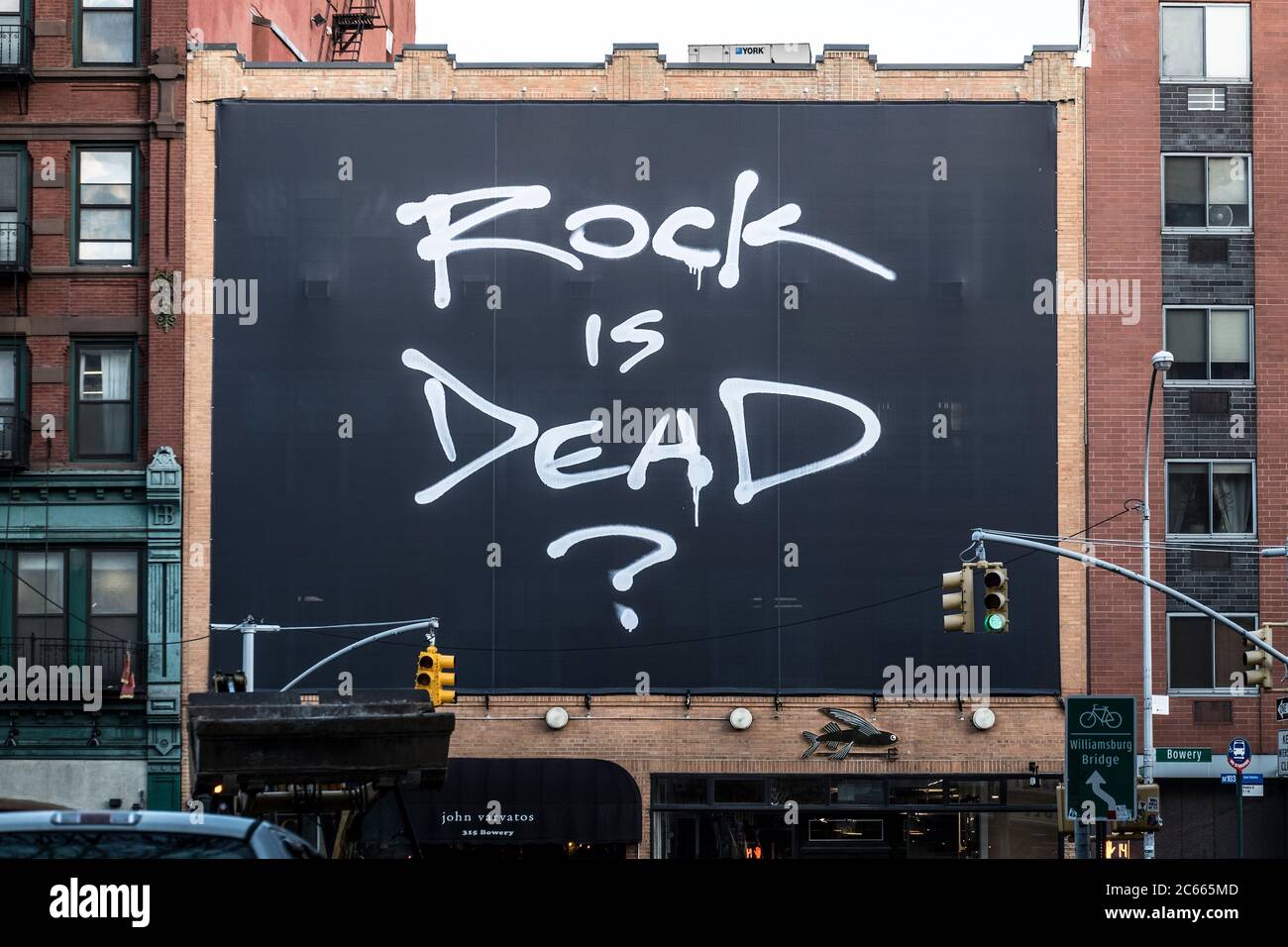 Huge sign 'Rock is Dead?' on a facade in New York, USA Stock Photo - Alamy