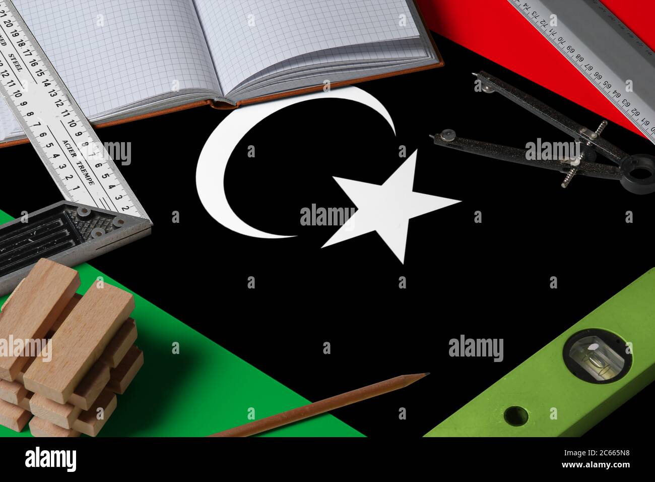 Libya national flag on profession concept with architect desk and tools ...