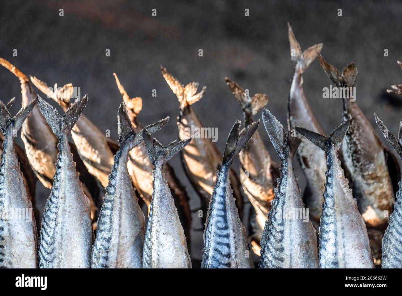Steckerlfisch fish grilled on a stick at the oktoberfest hi-res stock ...