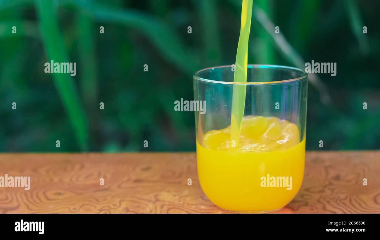 Mango juice in transparent glass juice hi-res stock photography and ...