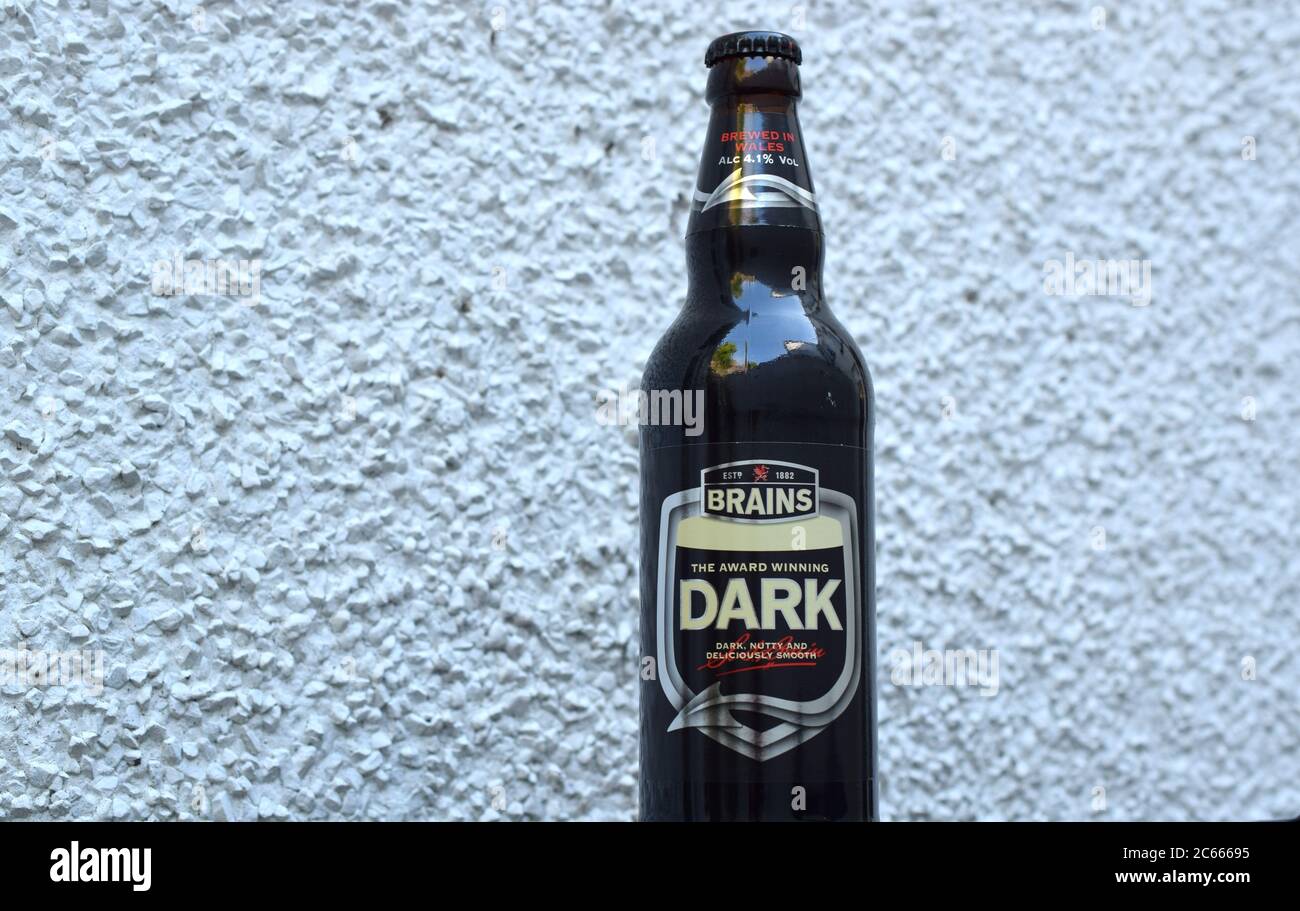 Dark beer bottle from Brains brewery on light textured background Stock ...