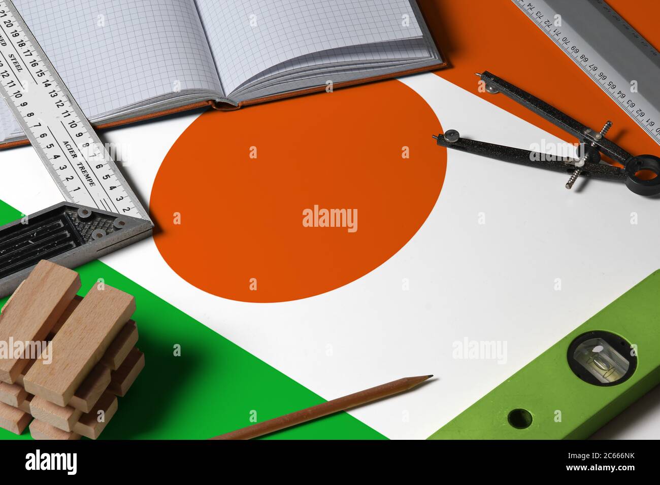 Niger national flag on profession concept with architect desk and tools ...