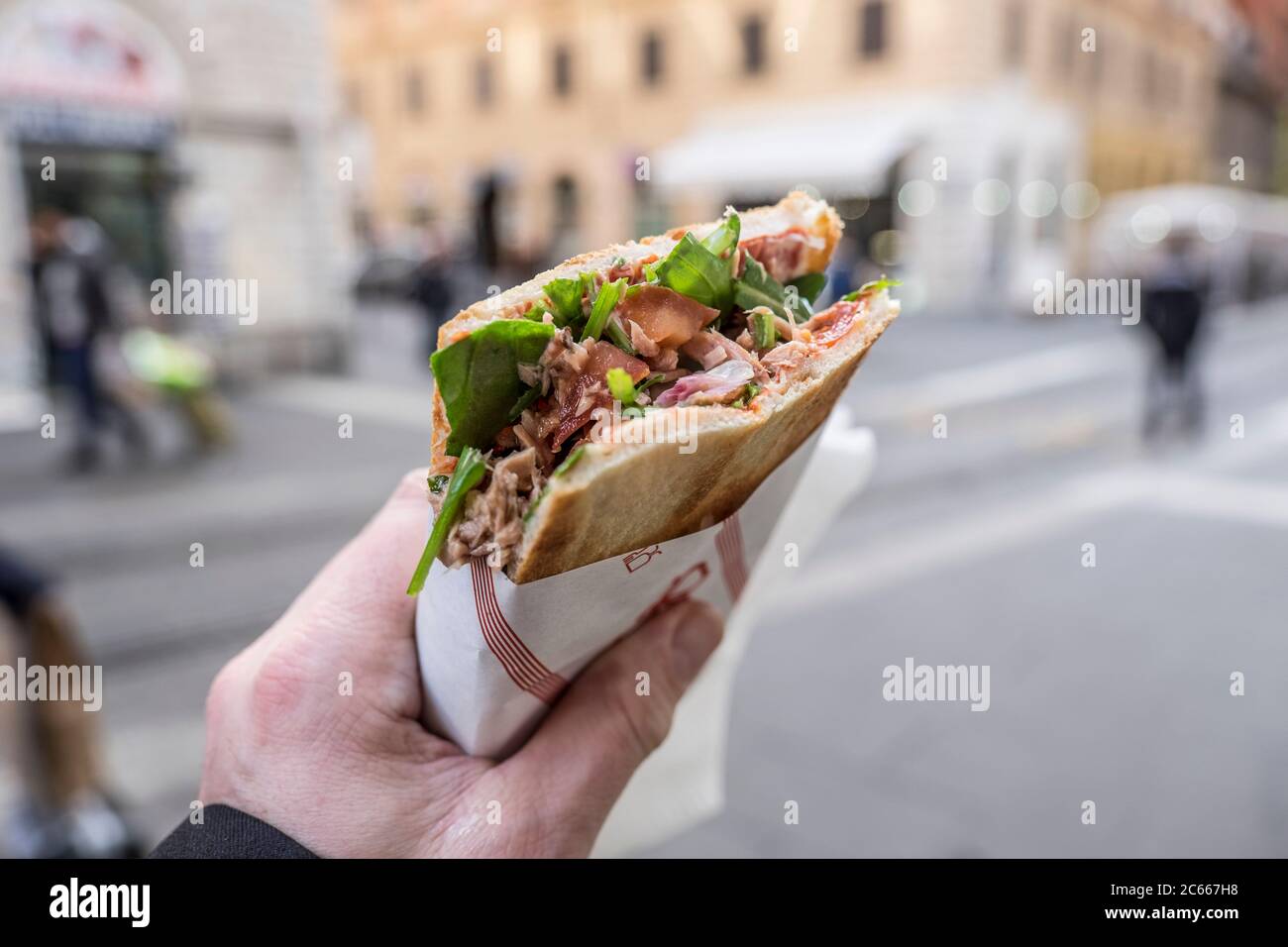 Hand holding Italian Panini Stock Photo - Alamy