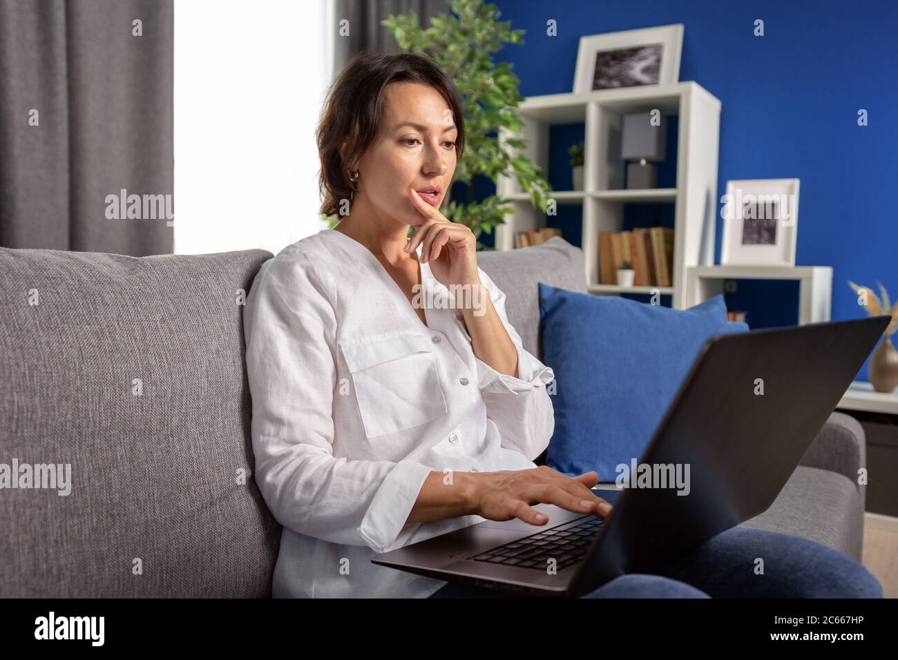 Beautiful thoughtful woman using hi-res stock photography and images ...