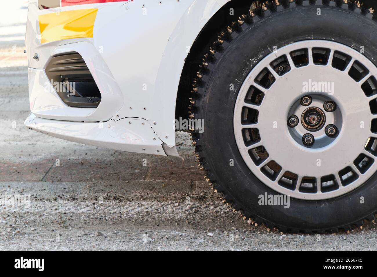 White rally car with a sport winter tire Stock Photo - Alamy