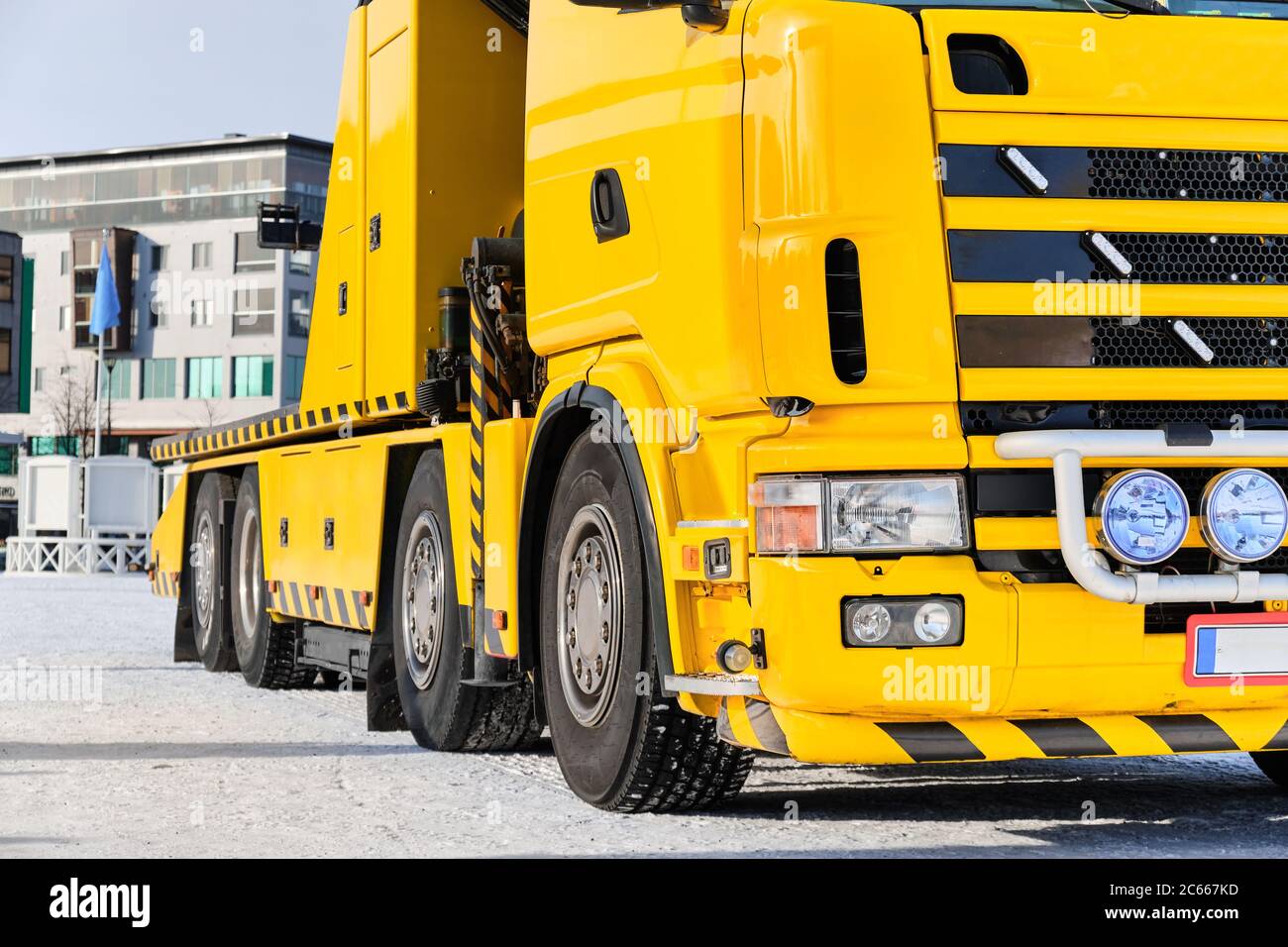 Yellow tow truck on the street Stock Photo - Alamy