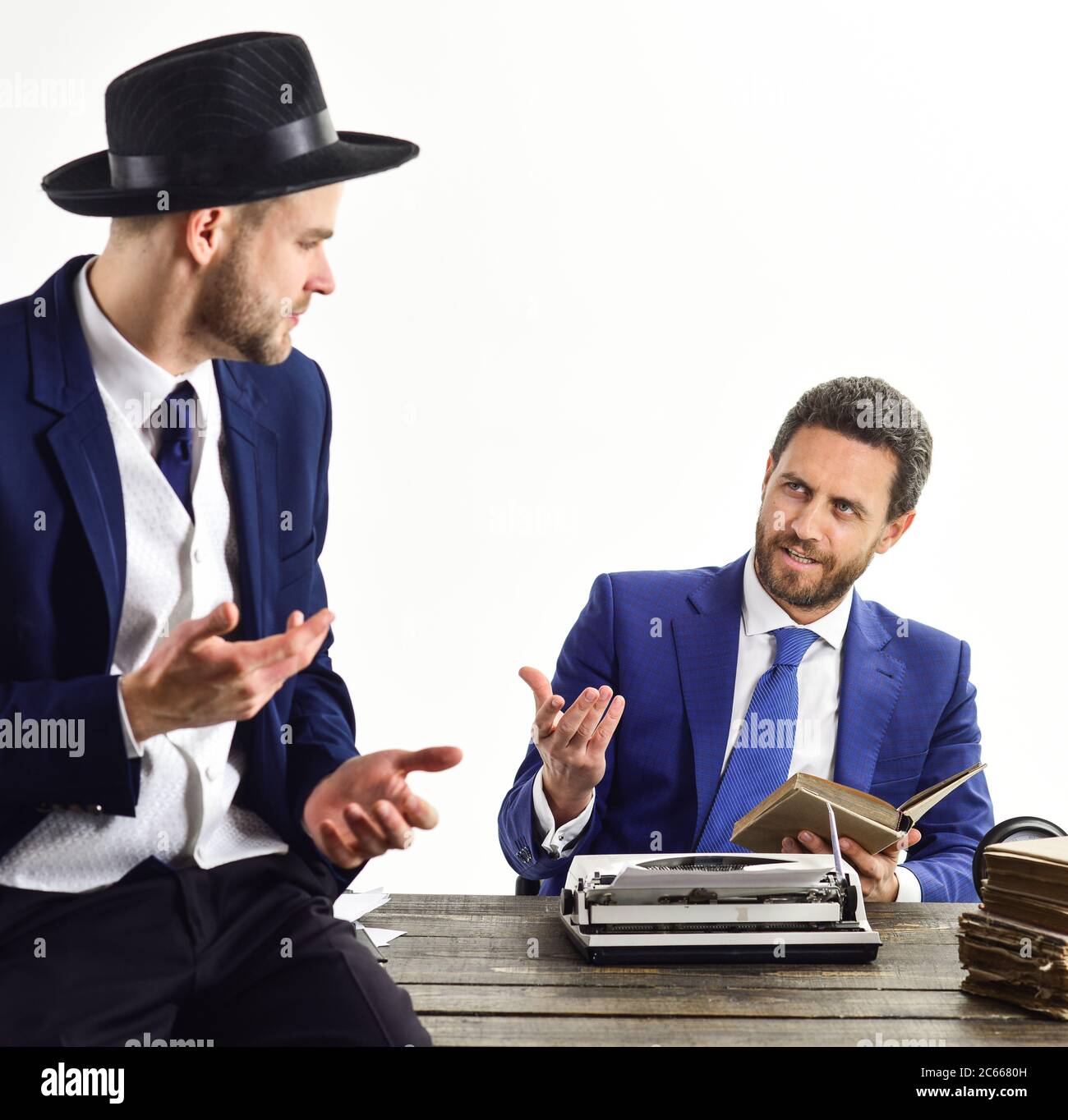 Partners met to discuss business deal. Businessman wears oldfashioned ...