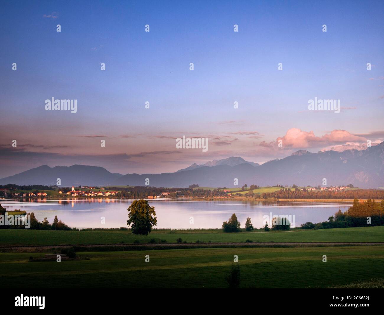 Lake Hopfensee in the light of the last sunrays Stock Photo - Alamy