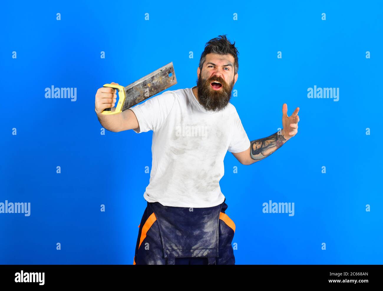 Dangerous builder concept. Man with shouting expression in dirty shirt ...