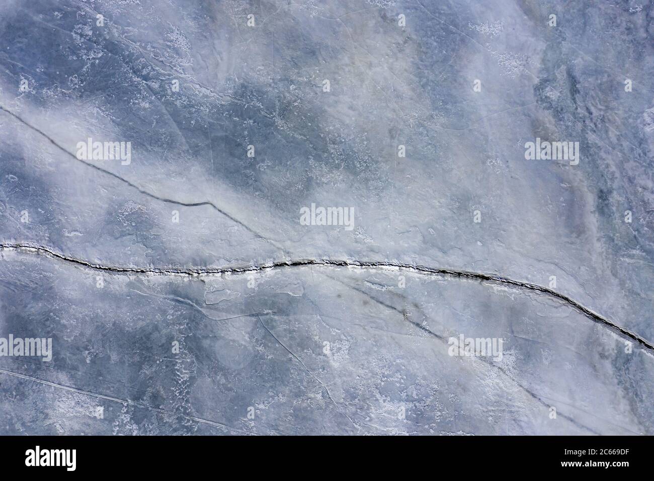 Aerial view of frozen lake. Ice from drone view. Background texture ...