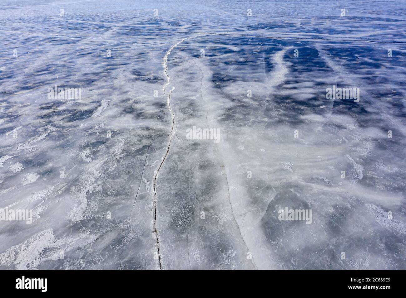 Aerial view of frozen lake. Ice from drone view. Background texture ...