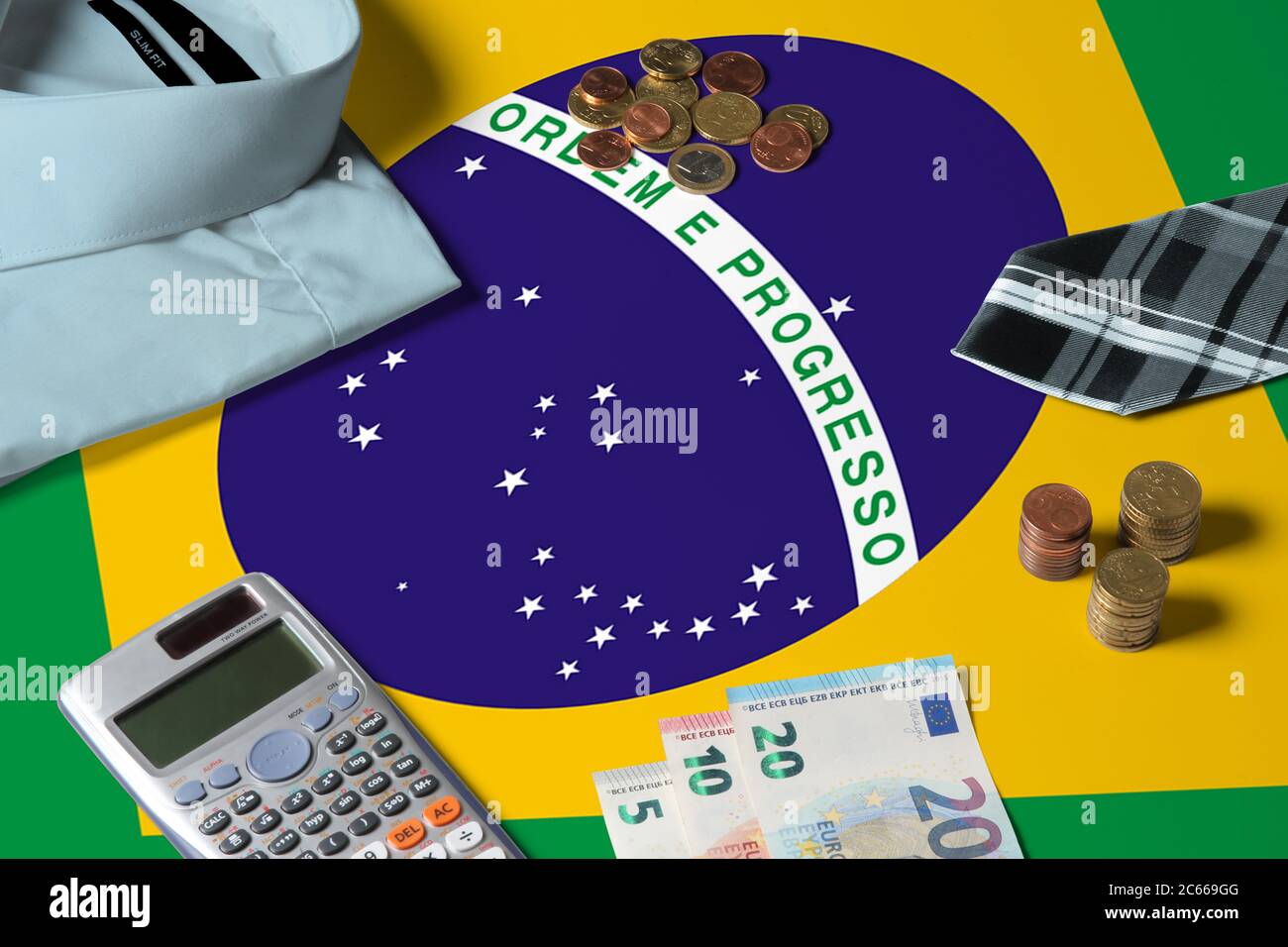 Brazil flag on minimal money concept table. Coins and financial objects ...