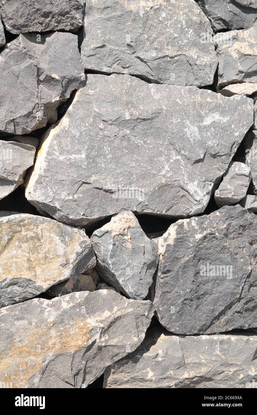 Texture Gray Rock Ancient Wall made of Volcanic Rocks Stock Photo - Alamy