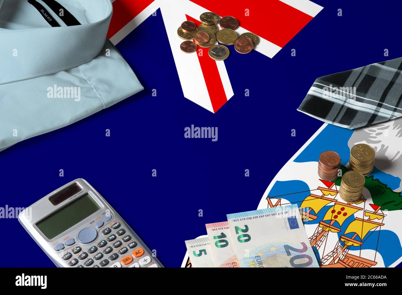 Falkland Islands flag on minimal money concept table. Coins and ...