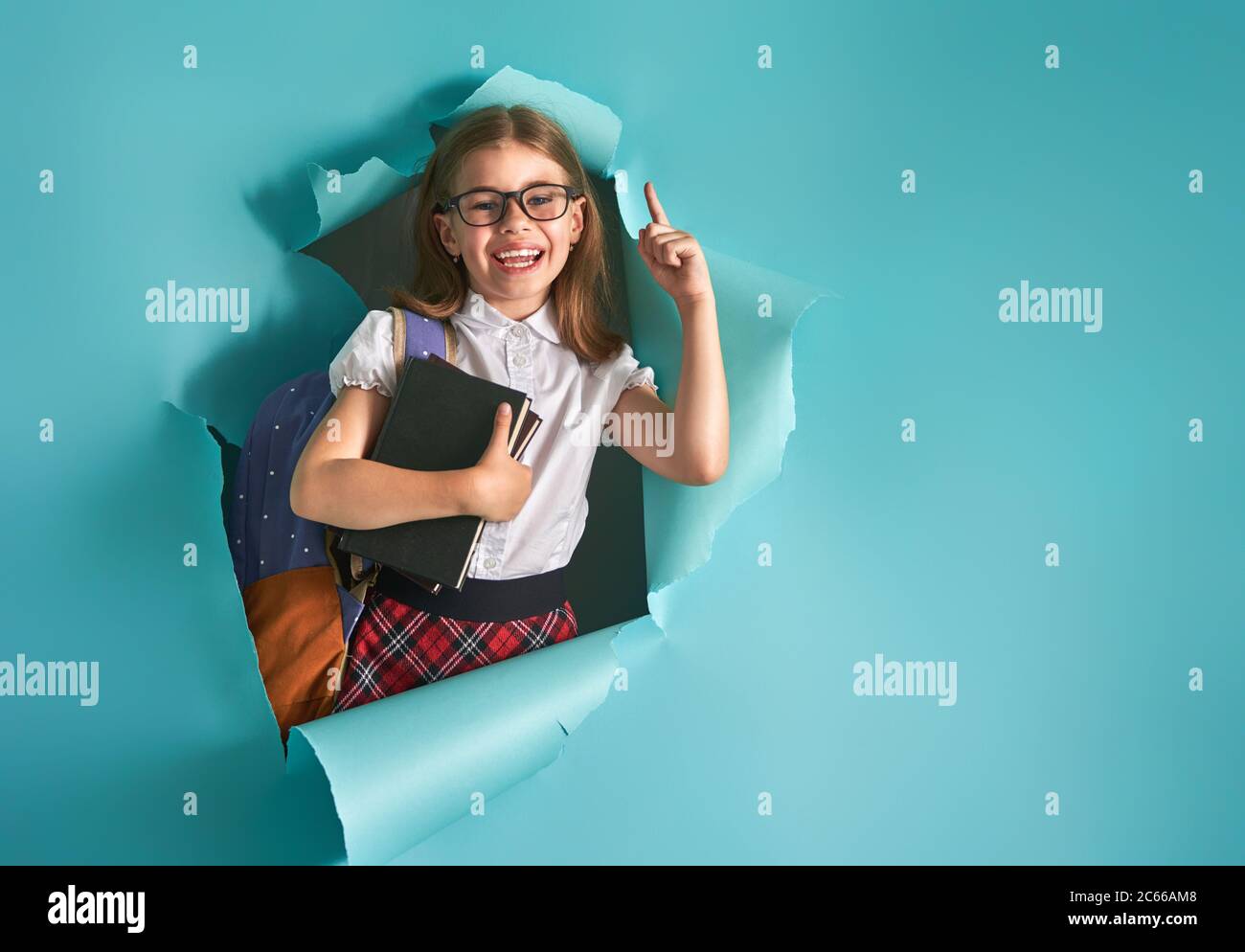 Back to school and happy time! Cute industrious child is breaking ...