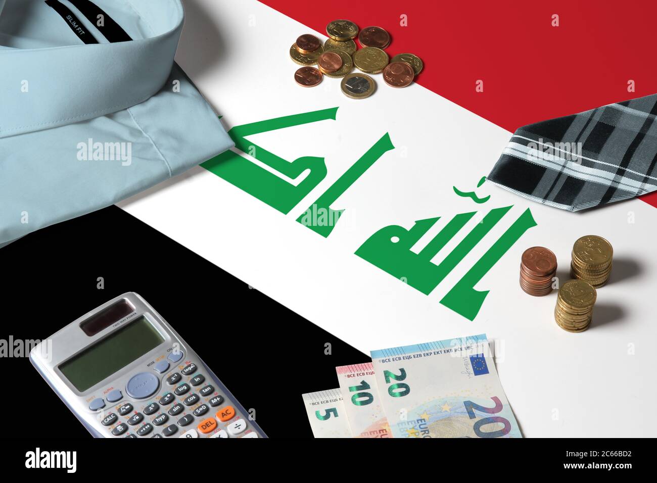 Iraq flag on minimal money concept table. Coins and financial objects ...
