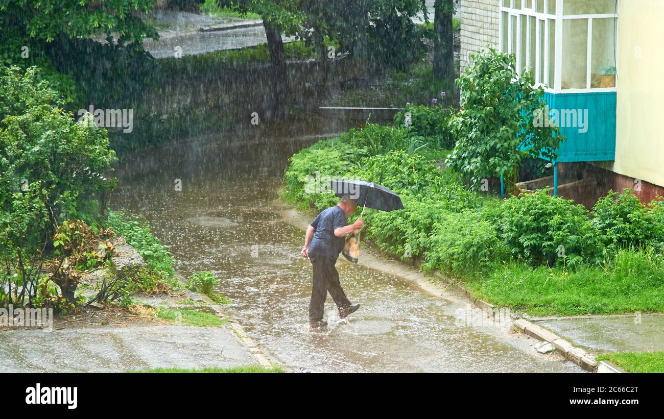 Man jumping in puddle hi-res stock photography and images - Alamy