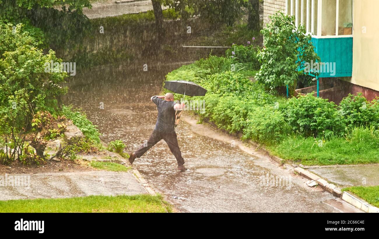 Man jumping in puddle hi-res stock photography and images - Alamy