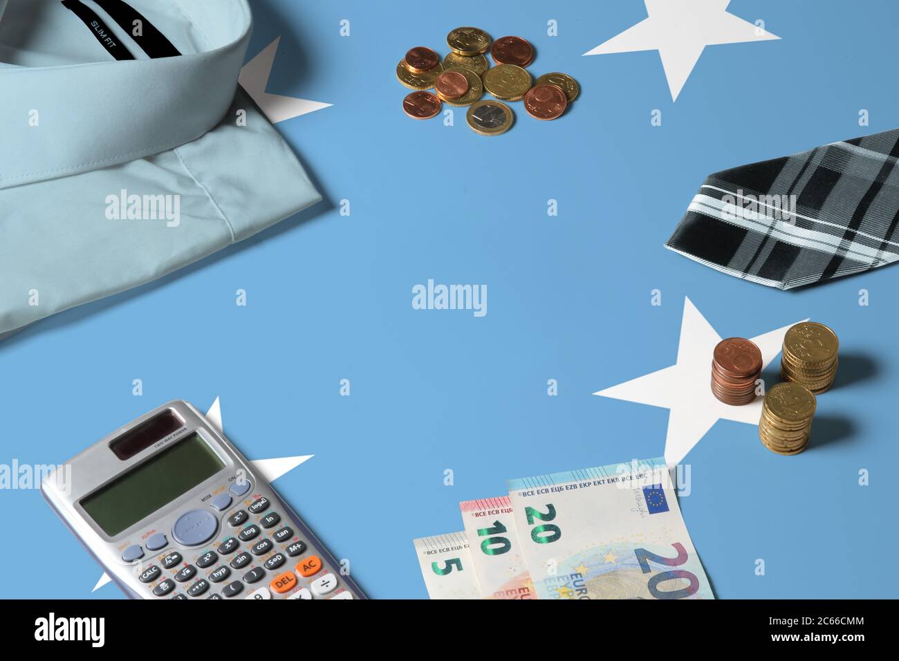 Micronesia flag on minimal money concept table. Coins and financial ...
