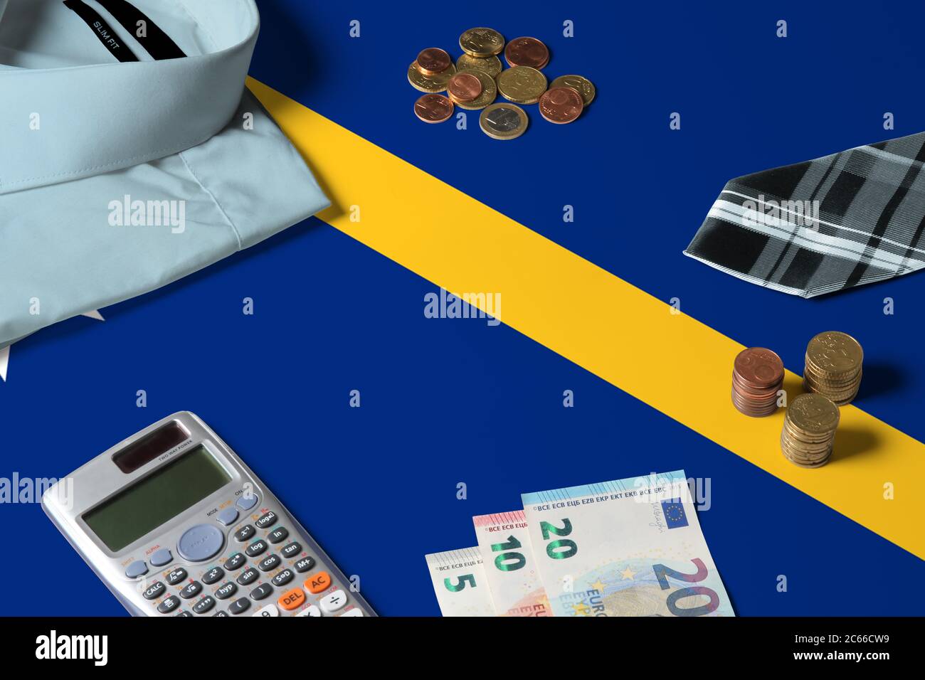 Nauru flag on minimal money concept table. Coins and financial objects ...