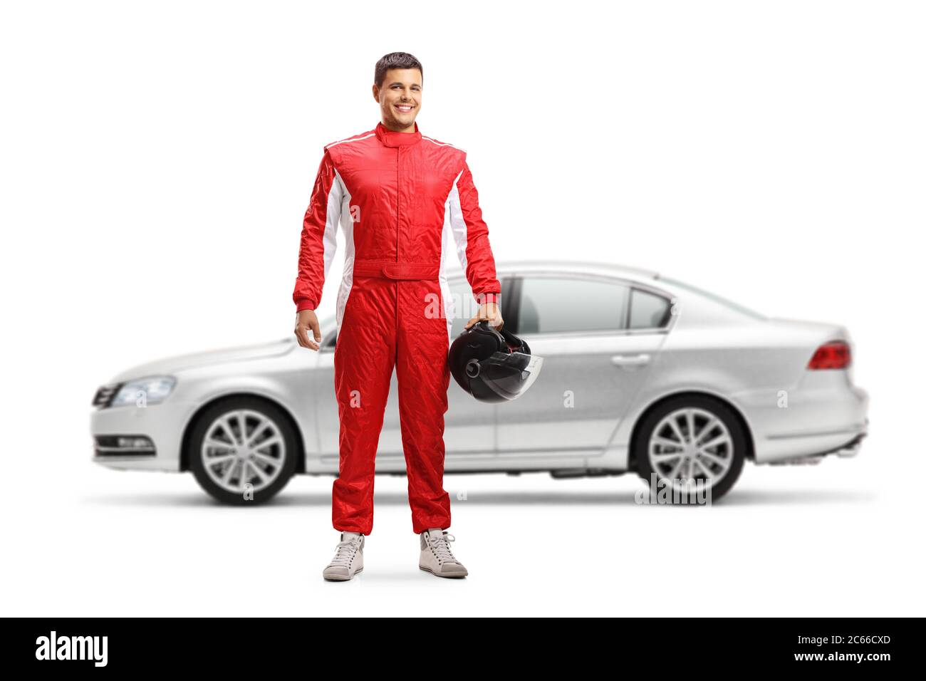 Full length portrait of a car racer posing in front of a silver car ...