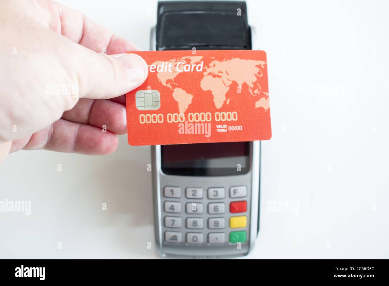 red Credit Card And Pos Terminal On White Stock Photo - Alamy
