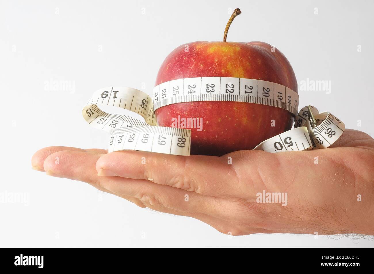Diet Apple and Meter on the Hand on a White Background Stock Photo - Alamy