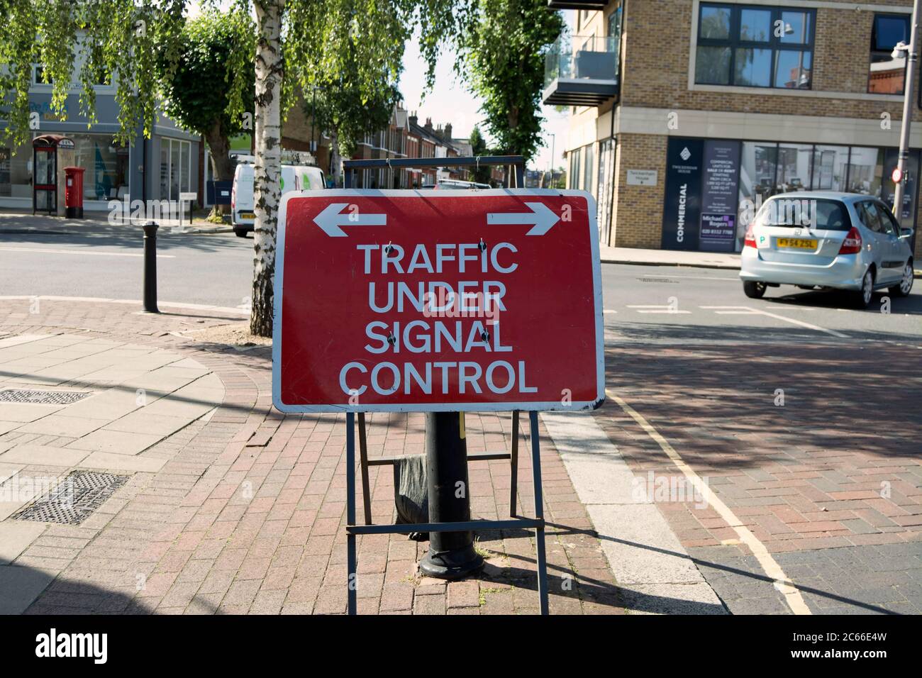 british road sign indicating traffic on the road ahead being under ...